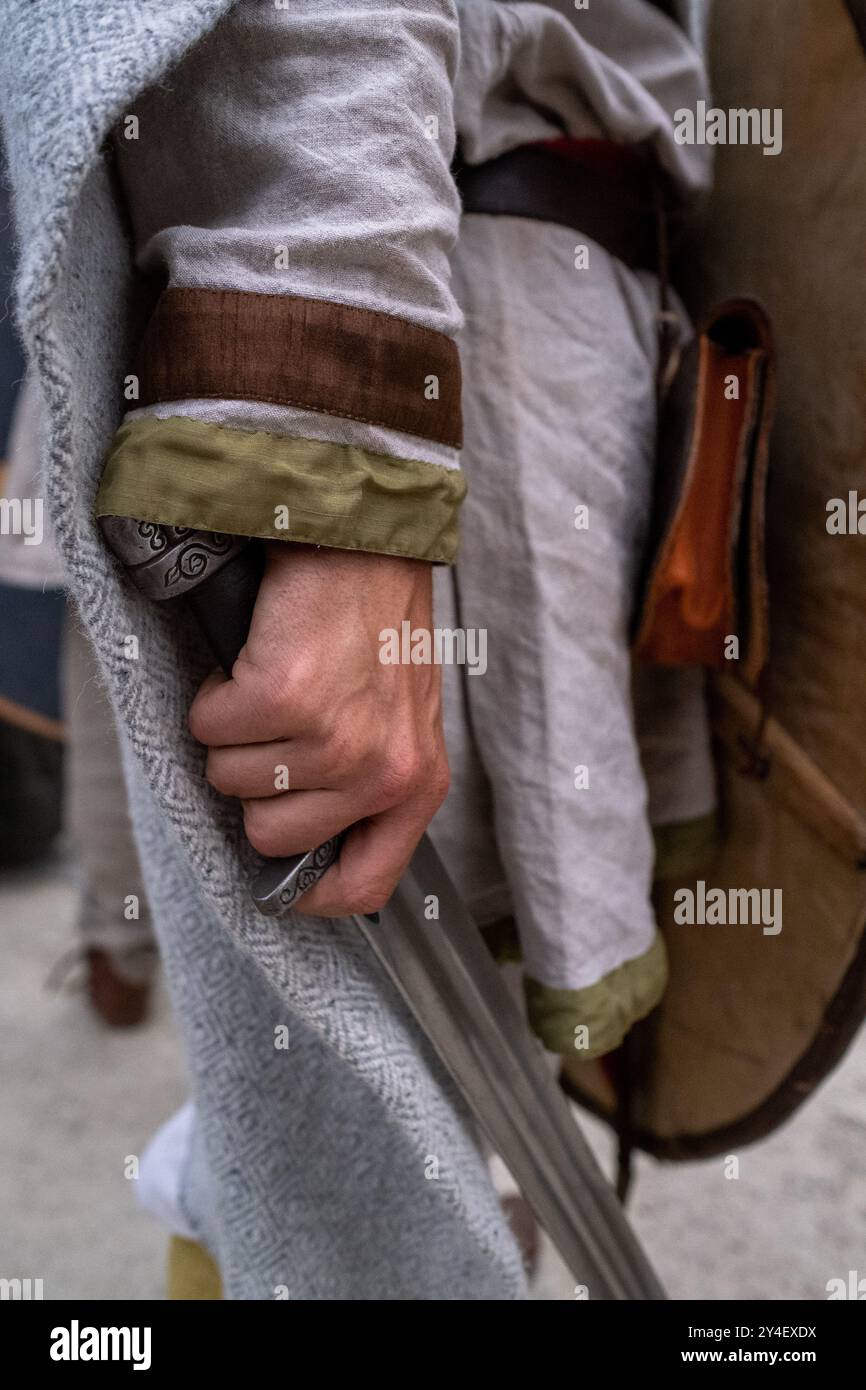Detail of a knight holding his weapon sword at the Fete des Remparts in ...