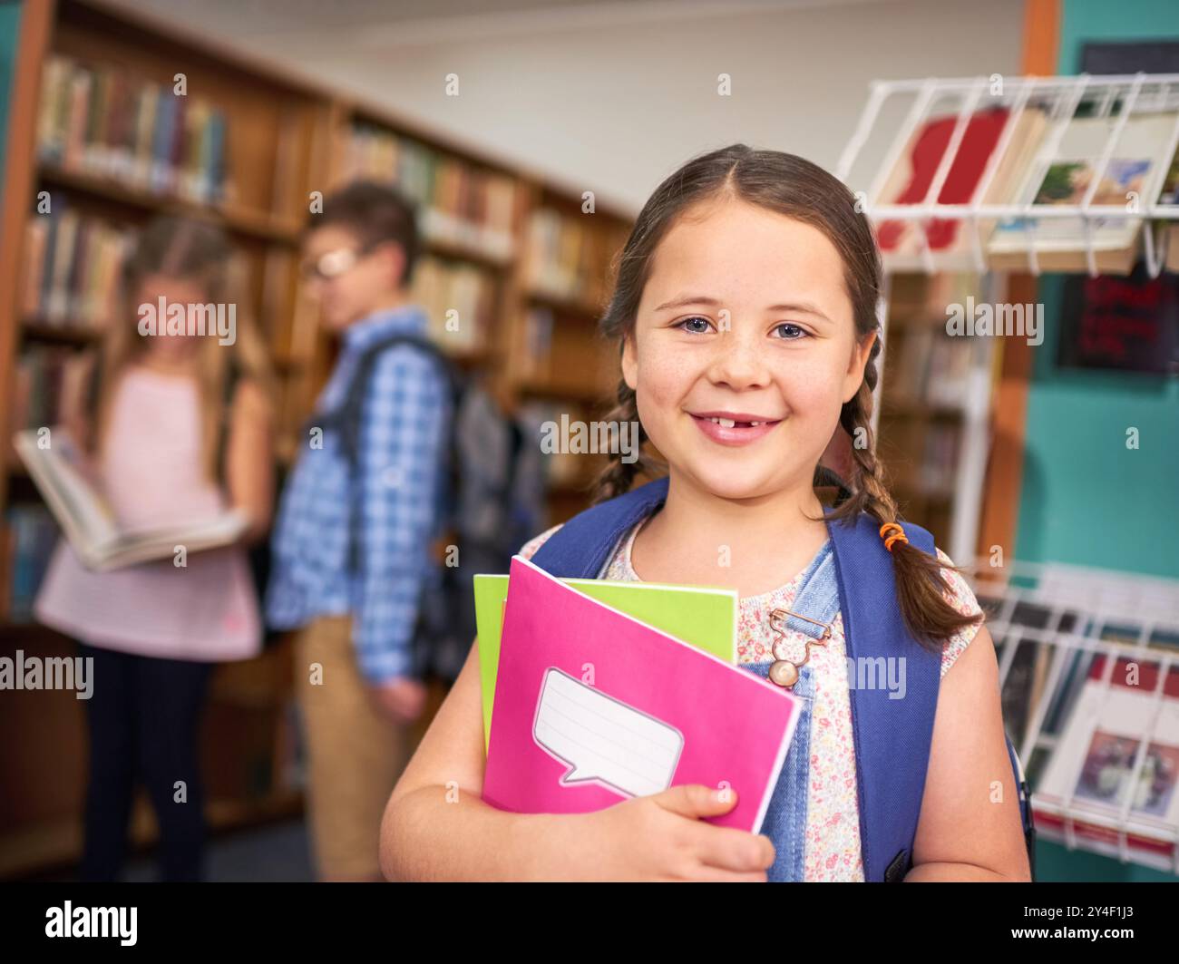 School, library and portrait of child with books for education, reading ...
