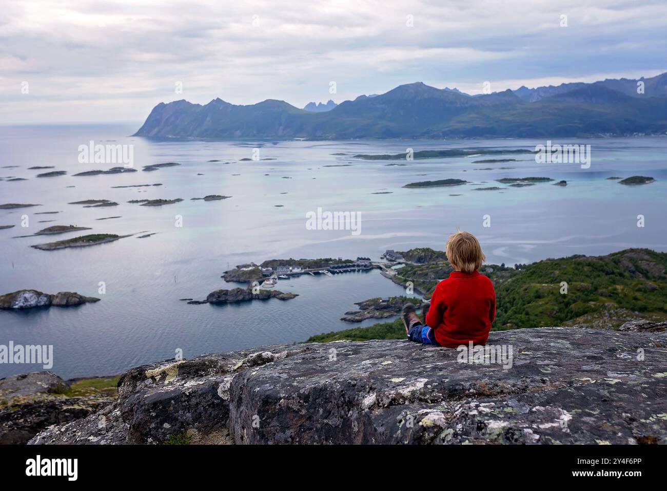 Family with children and pet, kids and adults hiking Sukkertoppen trail ...