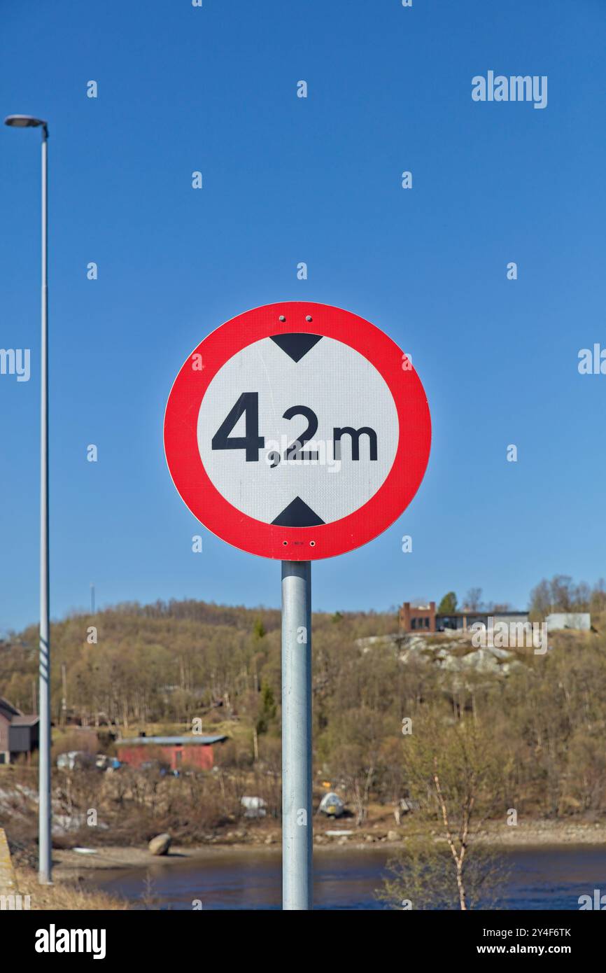 Warning road sign. A circle sign indicating height limit of 4.2 meters ...