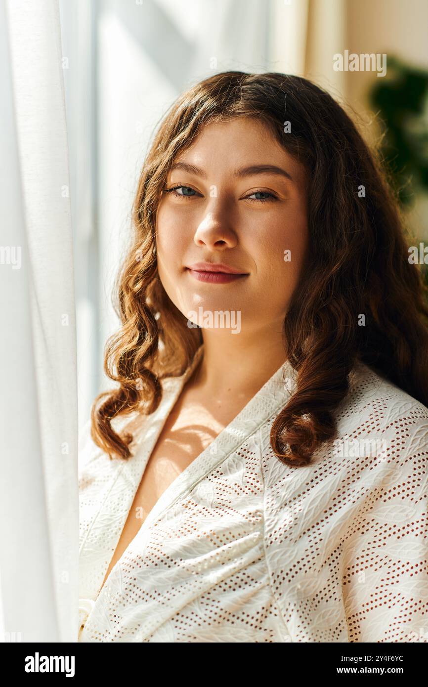 A young beautiful plus size woman radiates joy while basking in ...