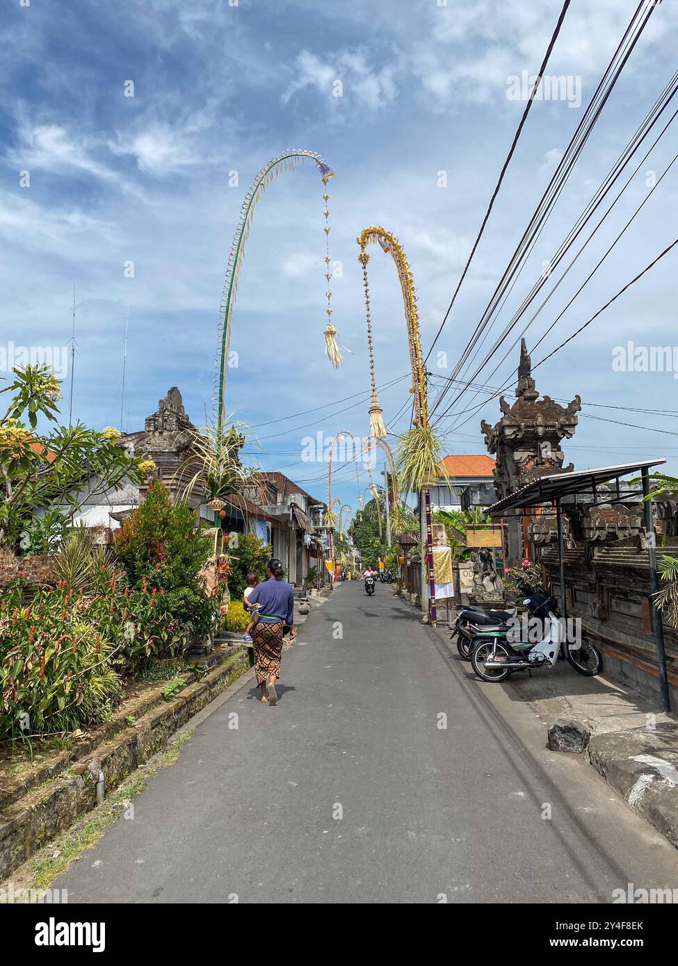 Traditional balinese penjors along the street of Bali, Indonesia. Tall ...
