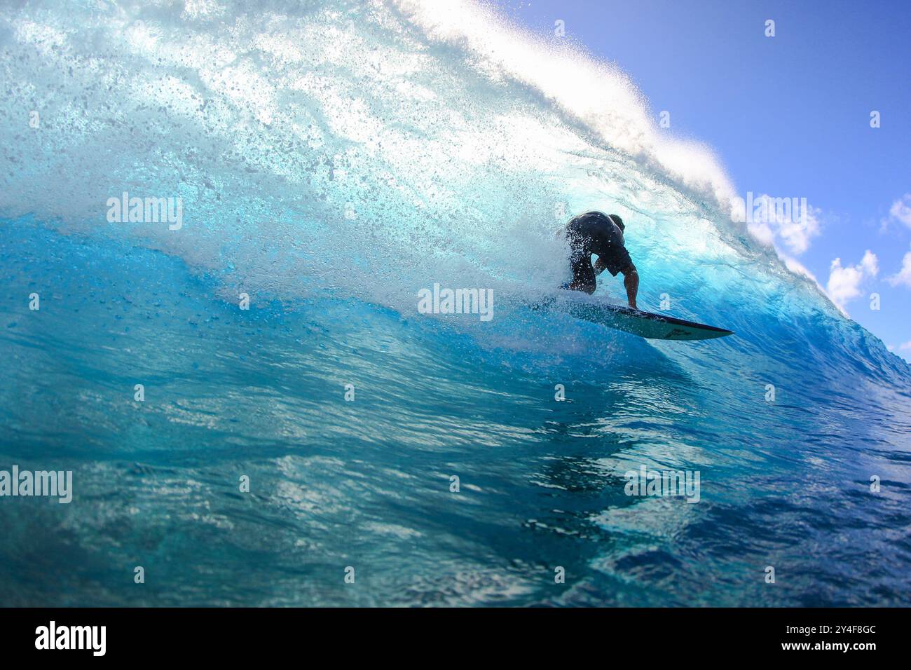 French Polynesia, Tuamotu archipelago, atoll of Faaite: surfer surfing ...