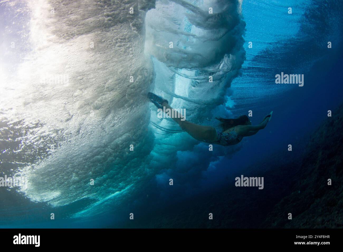 French Polynesia, Tahiti: surfing site at Teahupo'o: woman, surfer ...