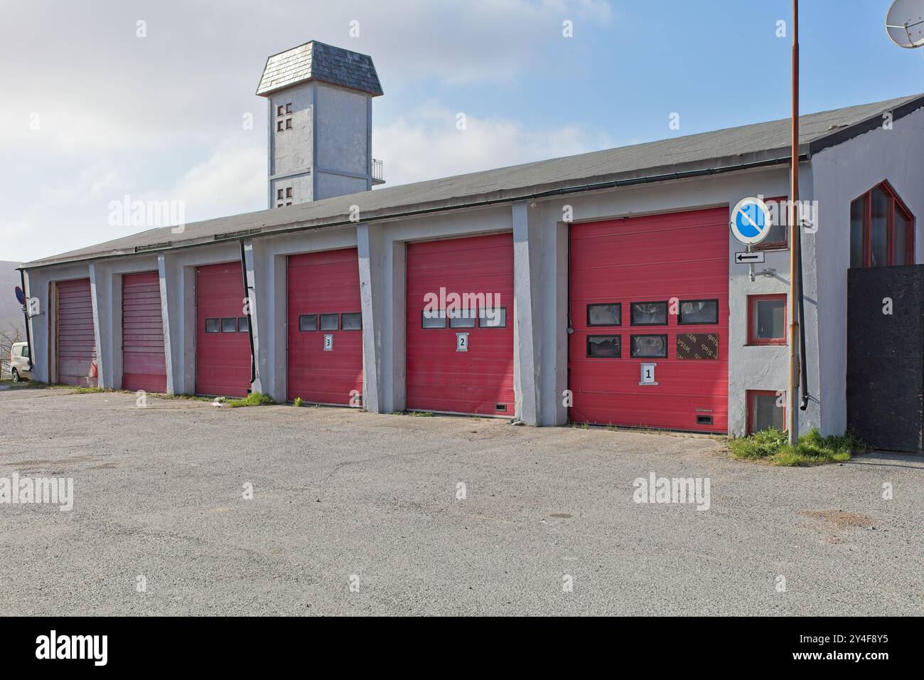 Old abandoned fire station building with tower Stock Photo - Alamy