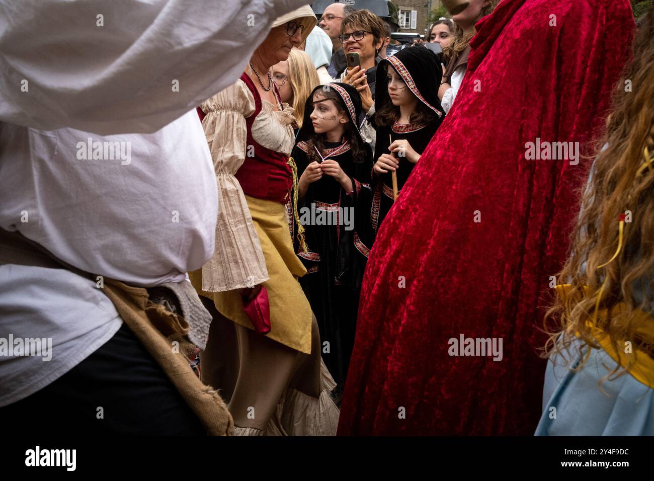 Children dressed as priests at the parade up Rue du Jerzual at the Fete ...