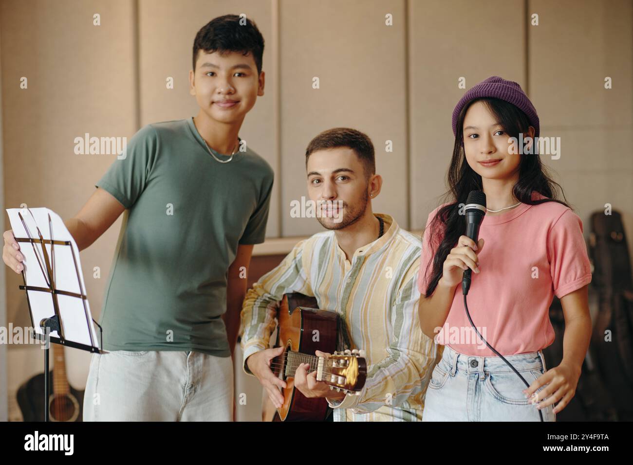 Diverse group young friends singing hi-res stock photography and images ...