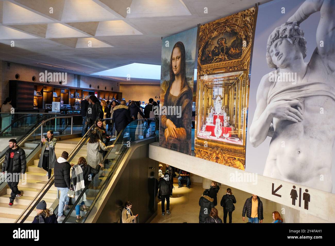 Paris (France): tourists in the hall of the Louvre Museum under the ...