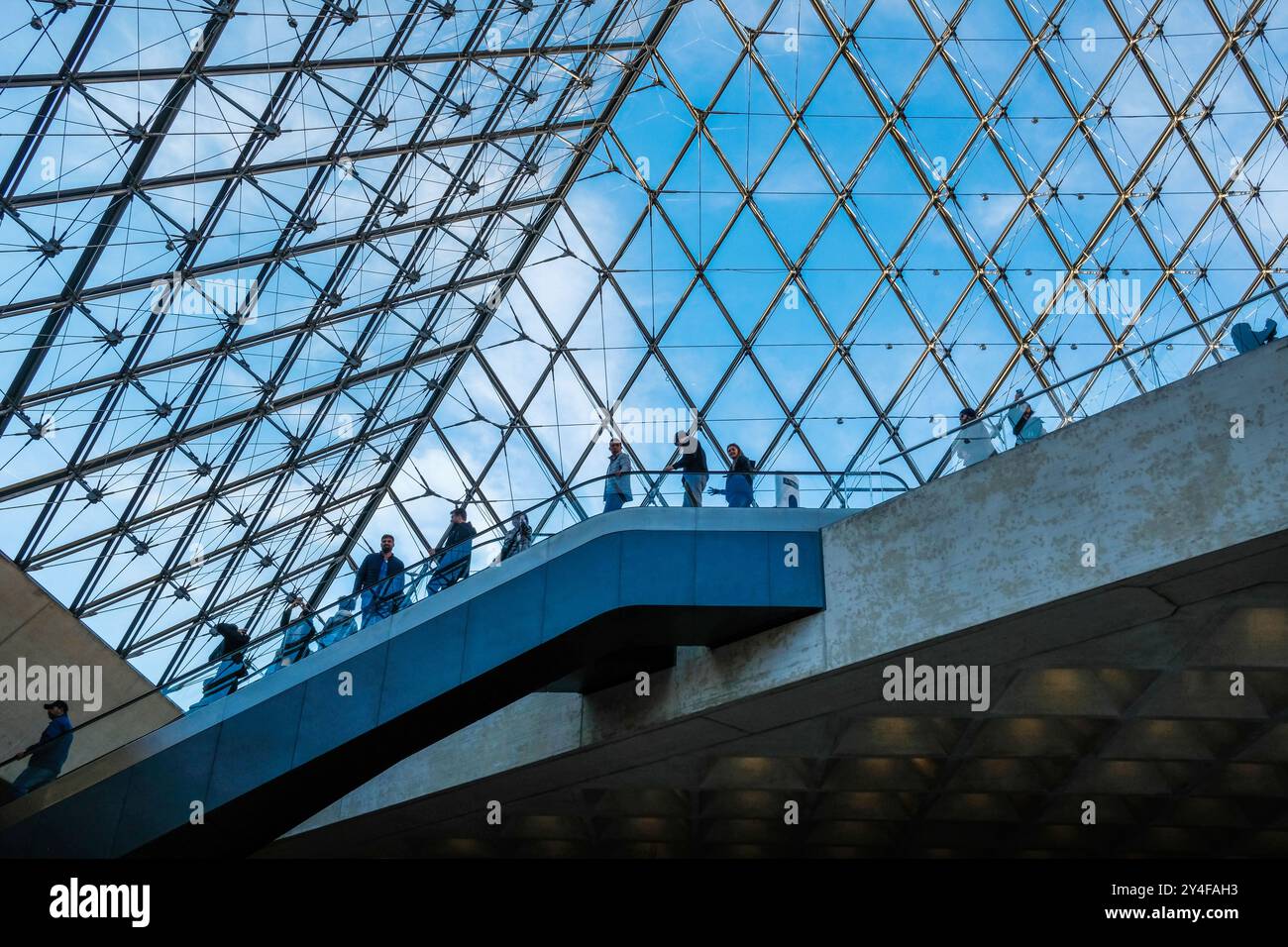 Paris (France): tourists in the hall of the Louvre Museum under the ...