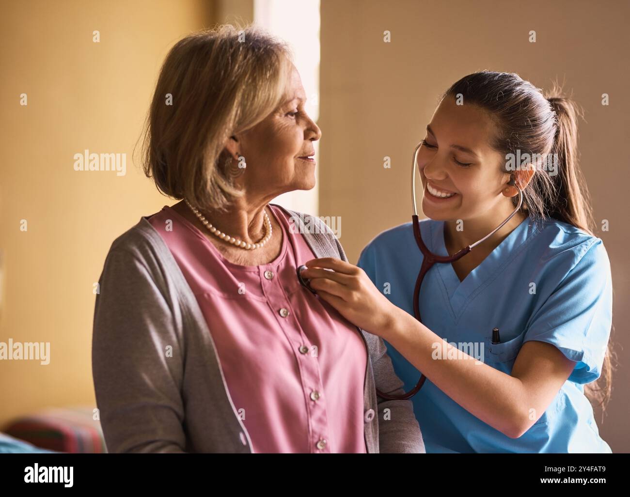 Senior woman, nurse and stethoscope for heart beat exam, check up or ...