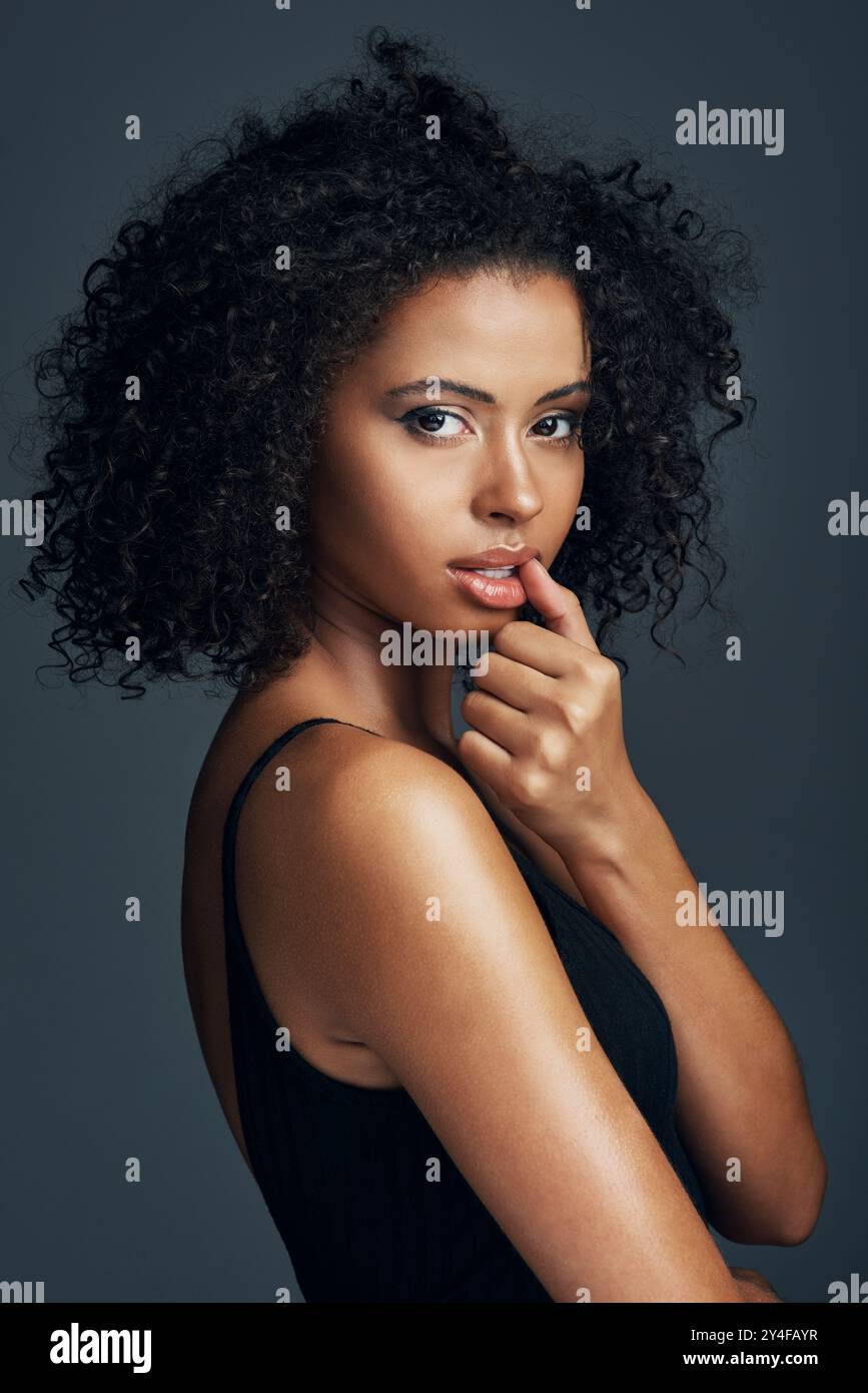 Brazilian woman, portrait and beauty in studio for hair care, natural ...