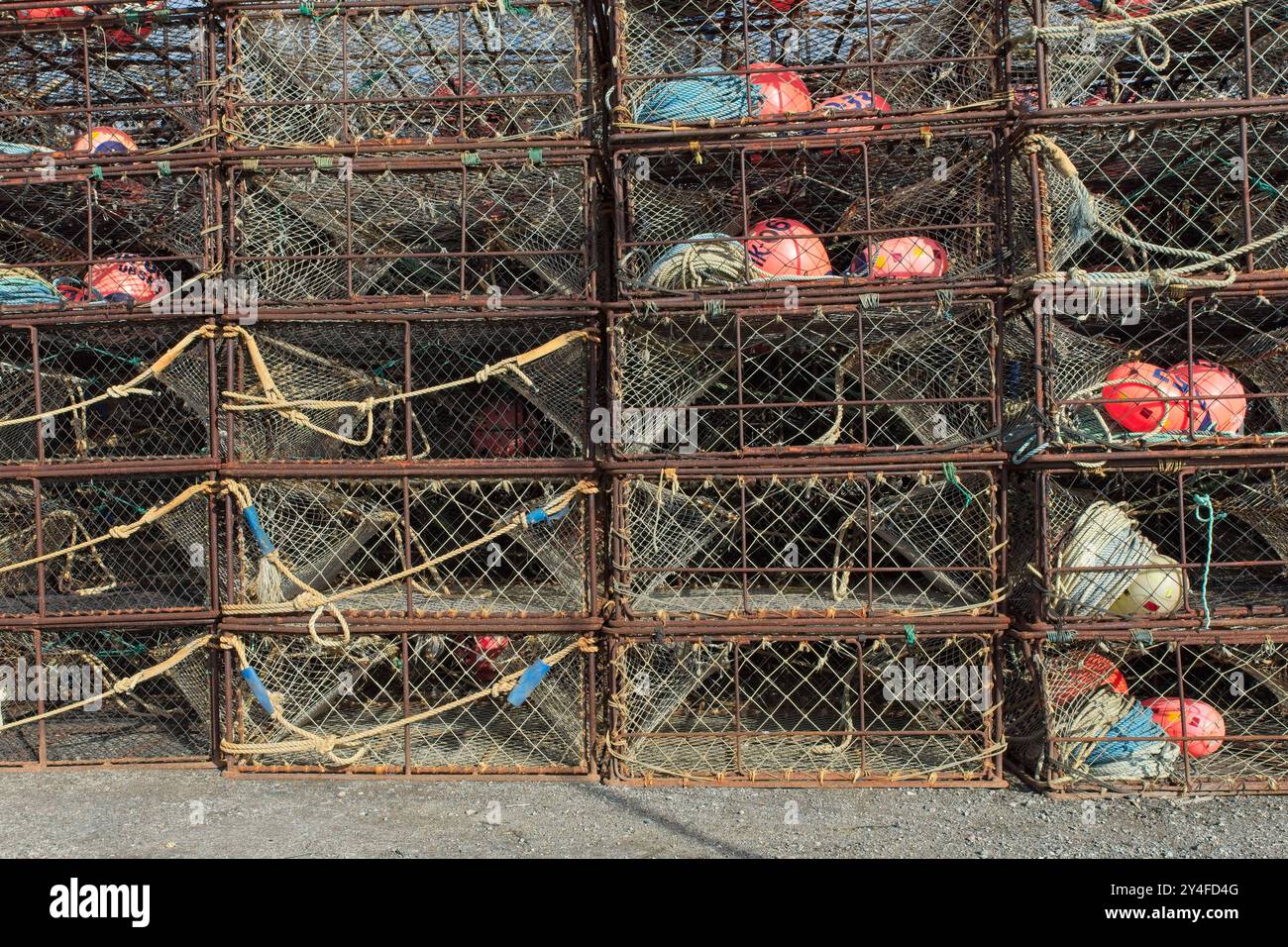 Closeup of empty old rusty crab cages stacked on the ground Stock Photo ...