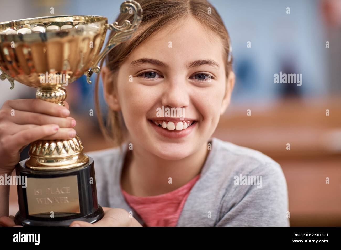 Girl portrait, child and trophy for education at school, learning achievement and math champion ...
