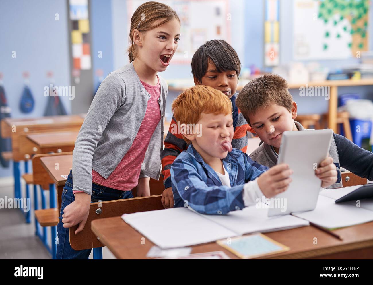 Tablet, selfie and children in classroom with fun, bonding or ...