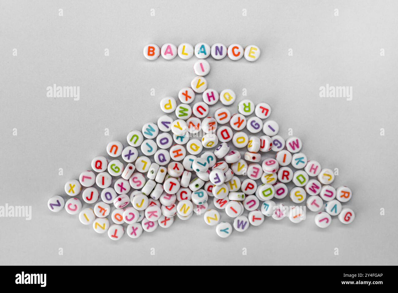 Balance Concept with Colorful Alphabet Stock Photo - Alamy