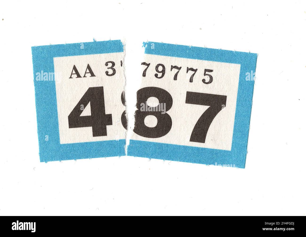 A raffle ticket torn in half on a white background Stock Photo - Alamy