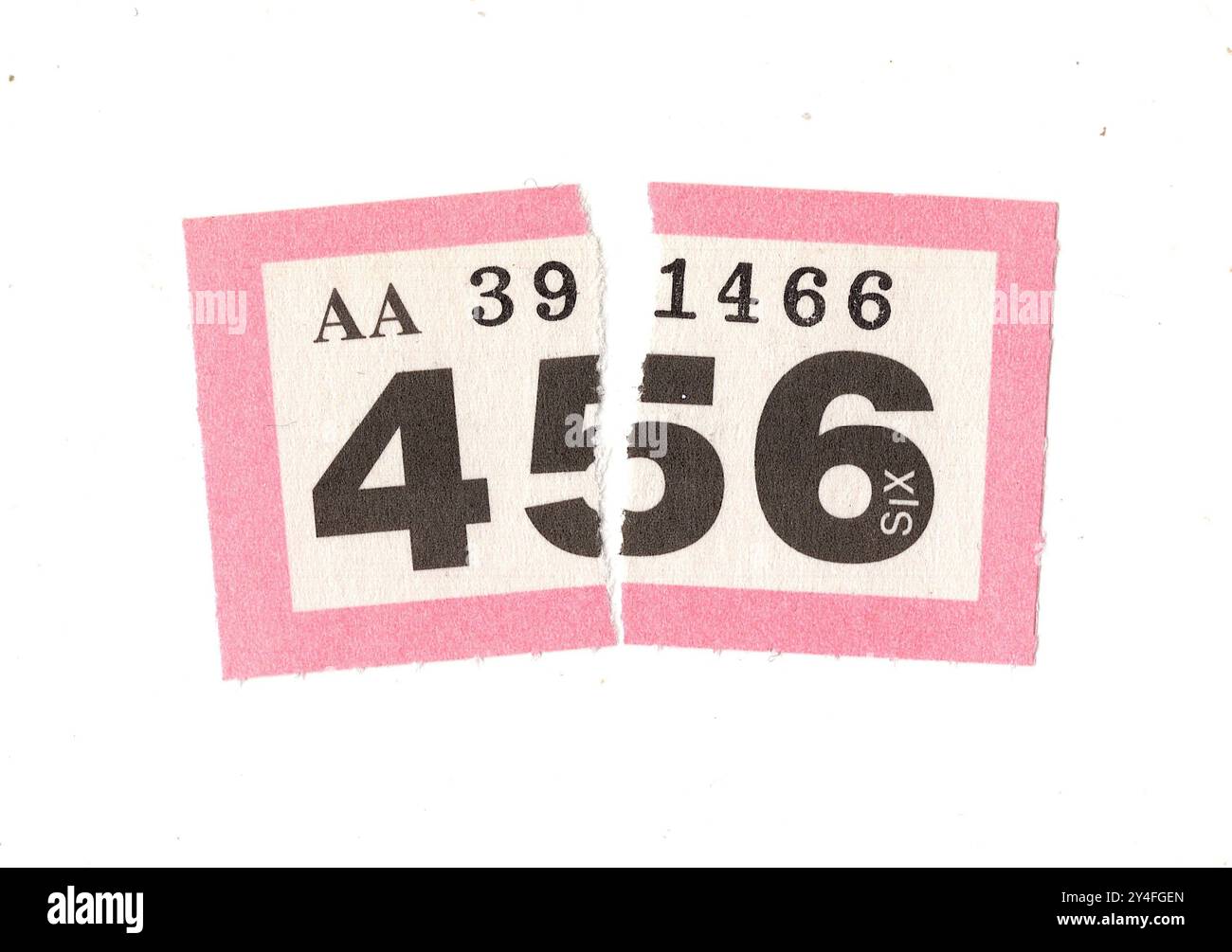 A raffle ticket torn in half on a white background Stock Photo - Alamy