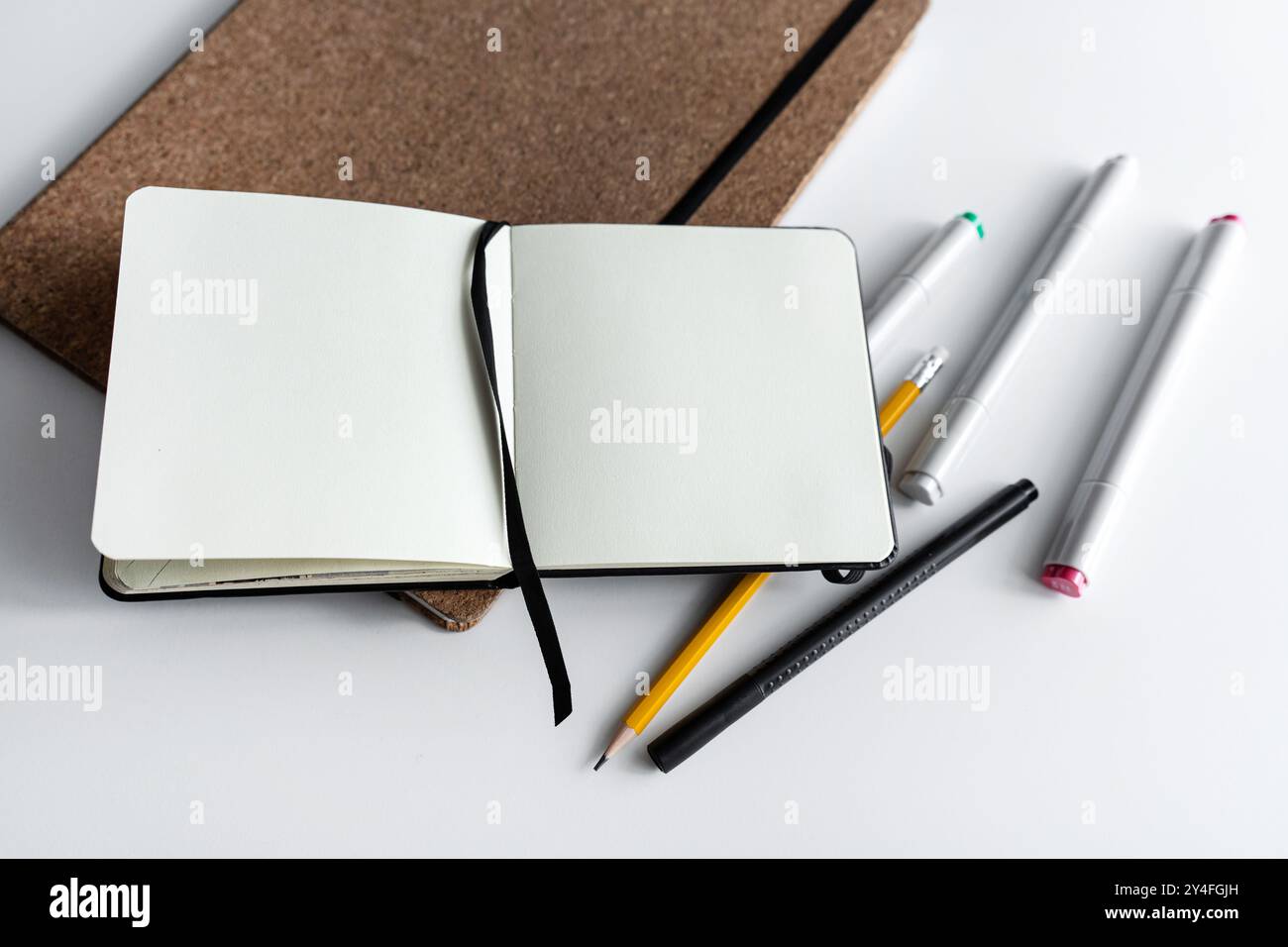 Open notebook with stationery for Stock Photo - Alamy