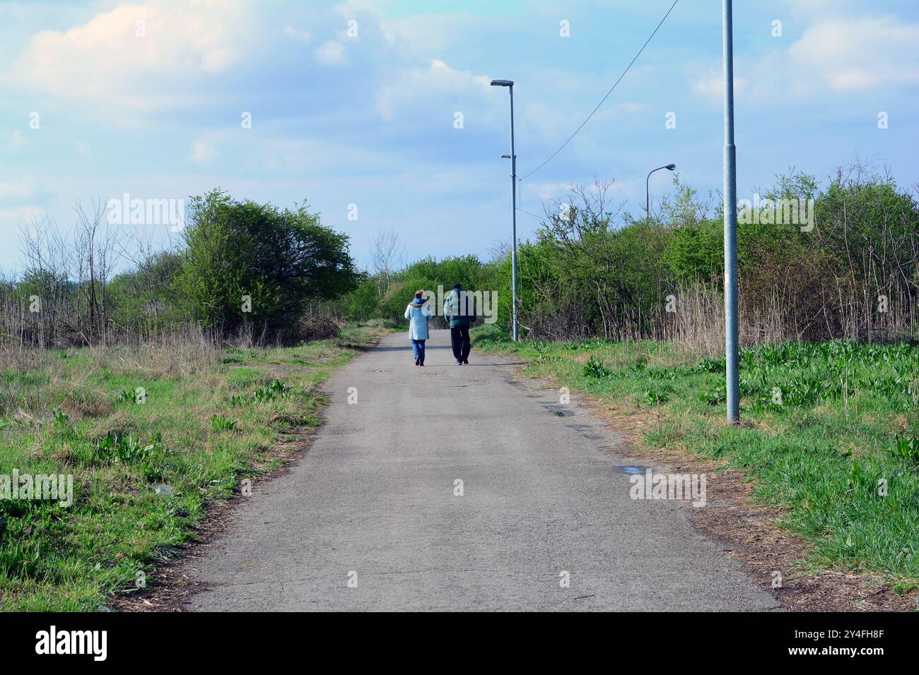 a couple walking on the path with greenery enviroment Stock Photo - Alamy