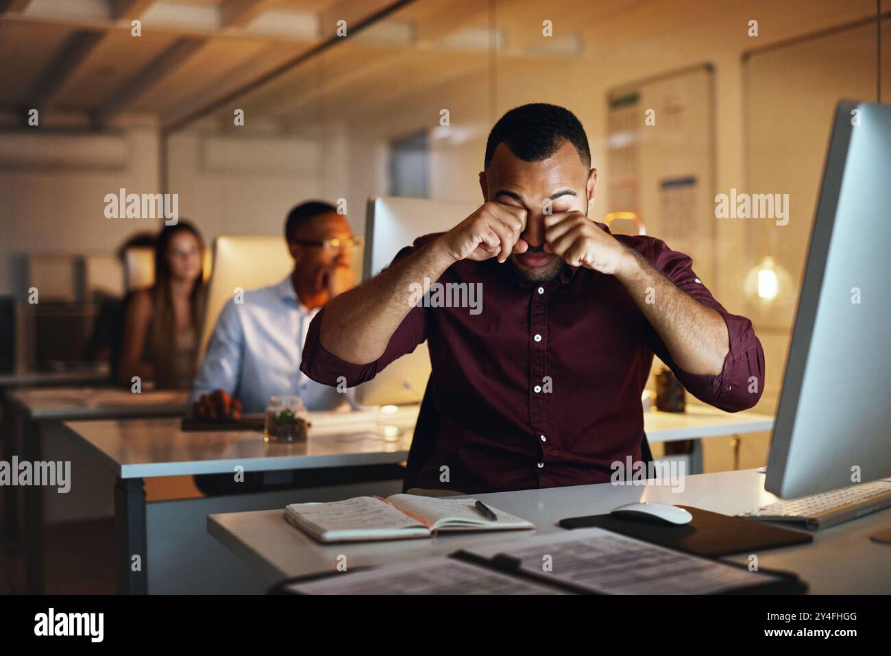 Tired, businessman and night with desktop, fatigue and working late in ...