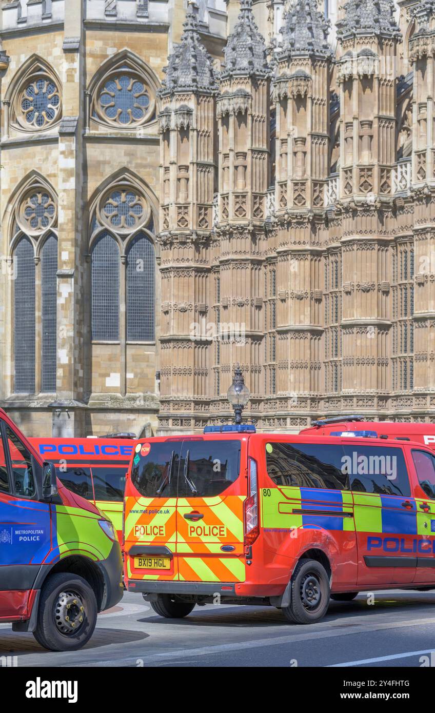 London, UK. Police vans parked in front of Westminster Abbey, opposite ...