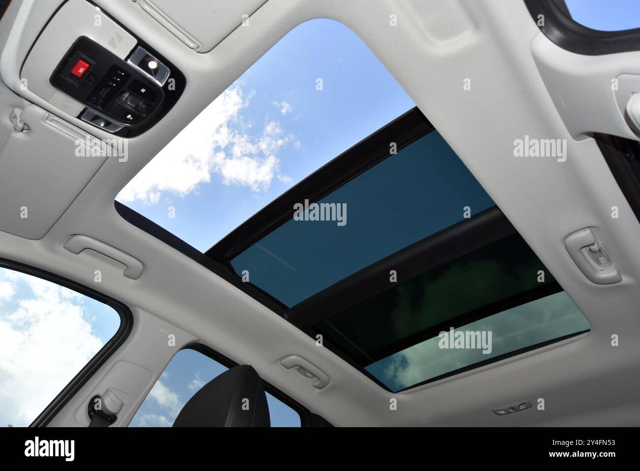 Large panoramic roof in the car, inside view Stock Photo - Alamy