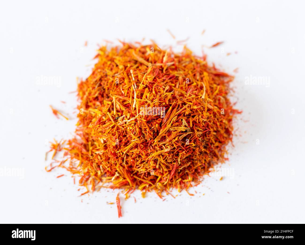 Close up shot on the white background of the dried saffron leaves spice ...