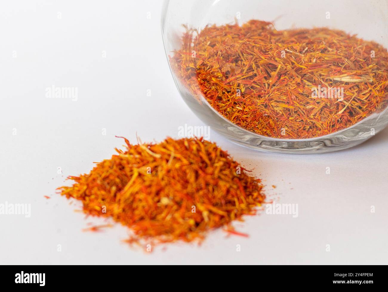 Close up shot on the white background of the dried saffron leaves spice ...