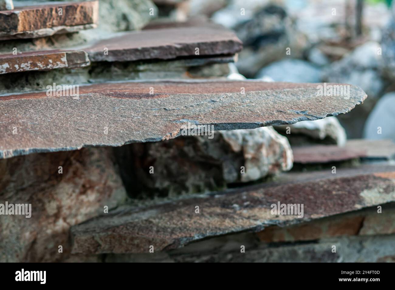 Close-Up of Layered Natural Stone Slabs in Outdoor Setting Stock Photo ...