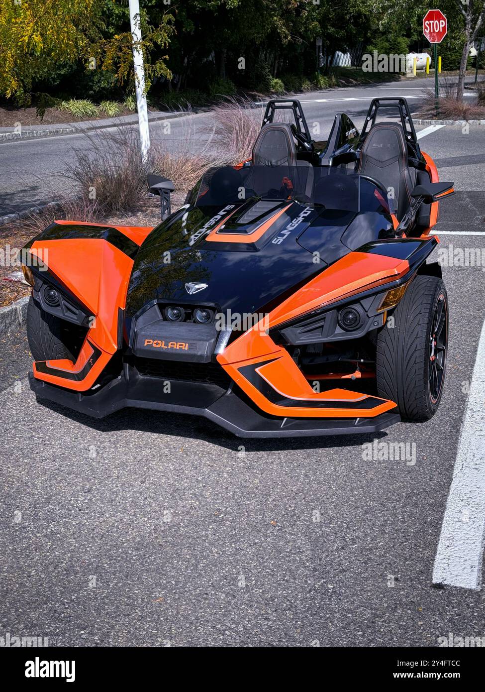An orange & black Polaris Slingshot SLR 3 wheeled roadster parked in ...