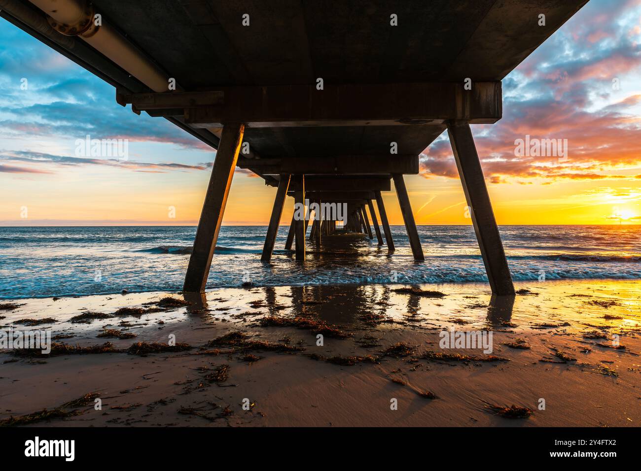 Glenelg Beach view from under the jetty at sunset, South Australia ...