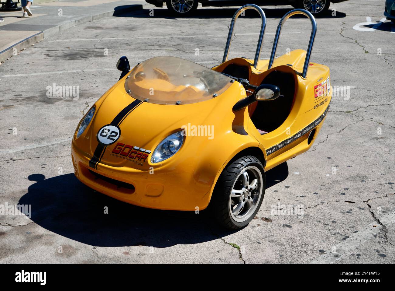 Yellow fibreglass GoCar number 62 in the sunshine Stock Photo - Alamy