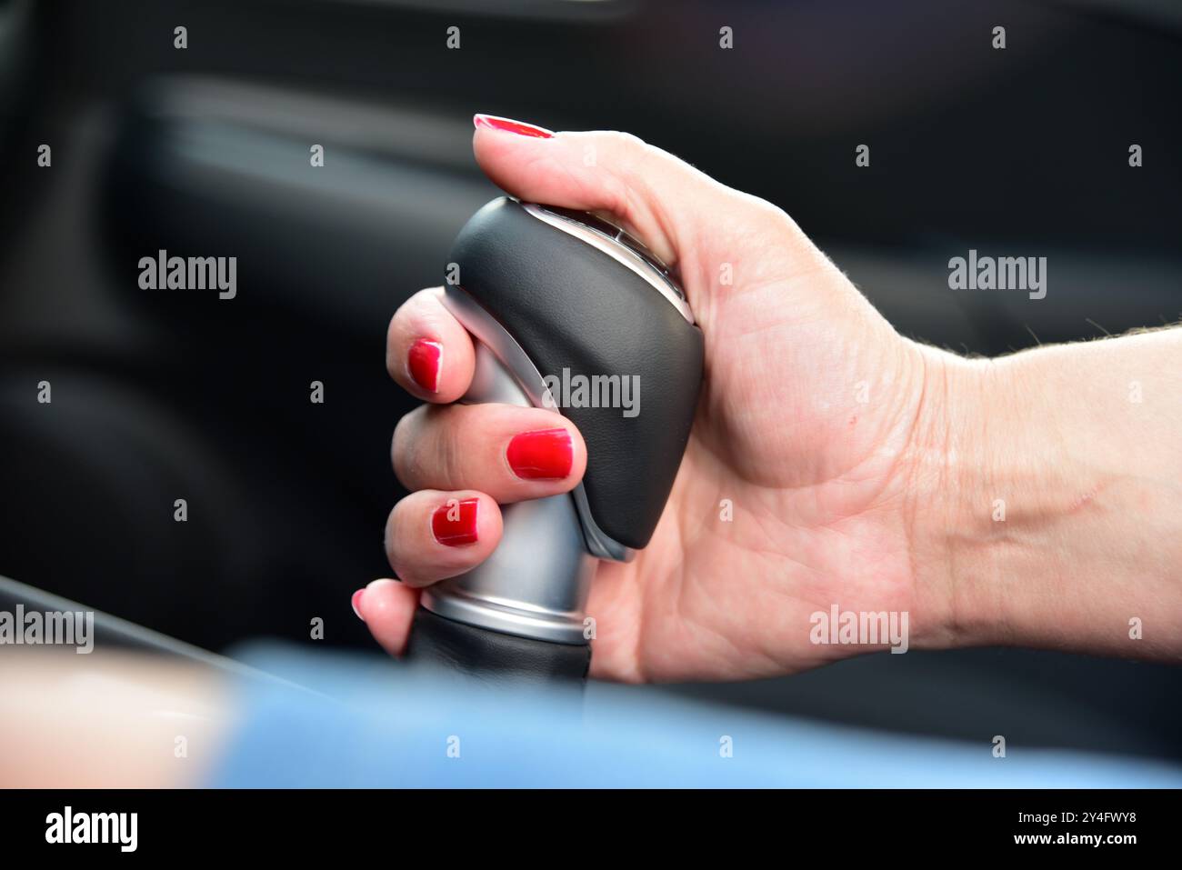 Woman shift gears in car Stock Photo - Alamy