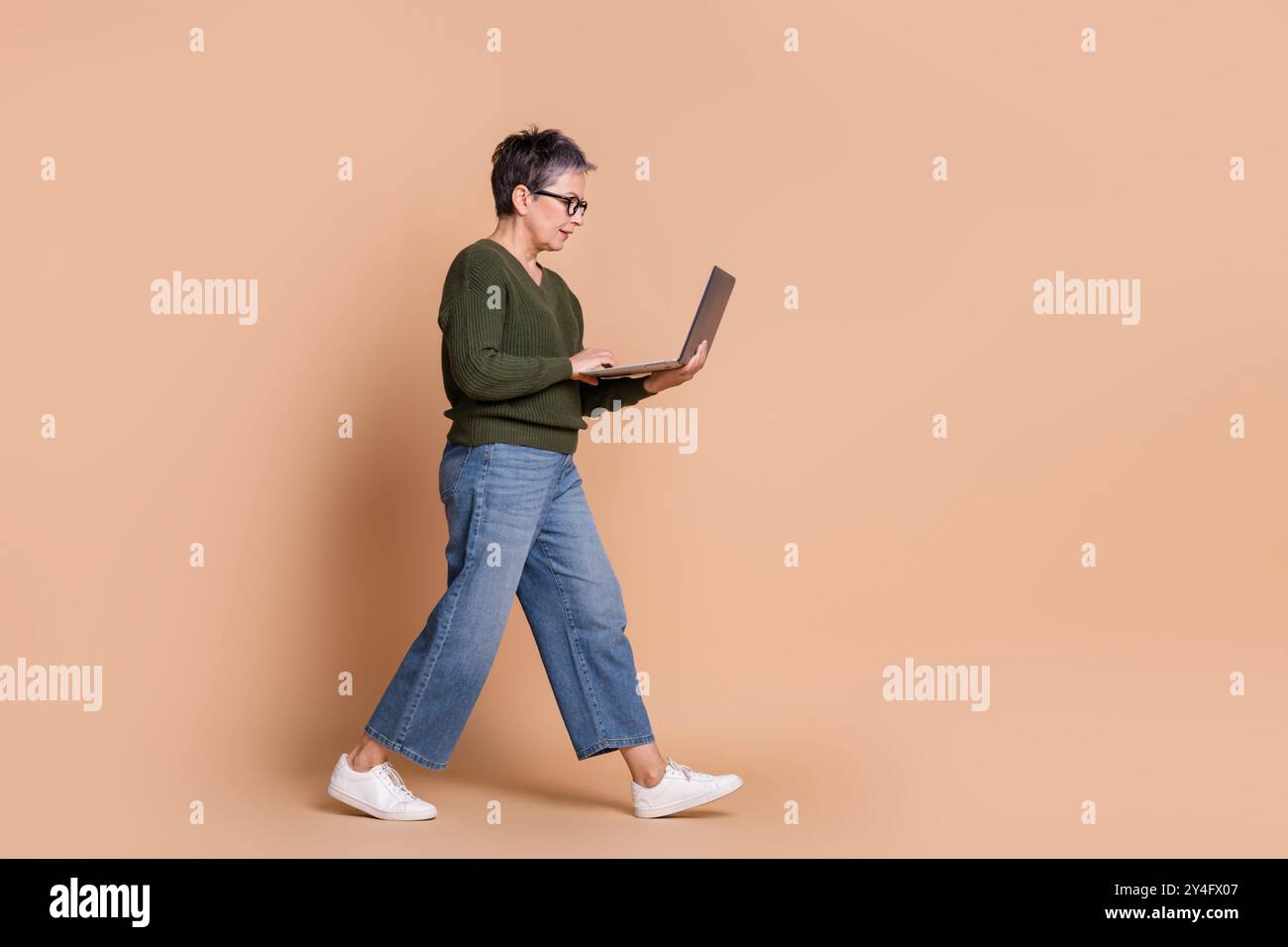 Photo of charming successful mature woman wear green stylish clothes ...