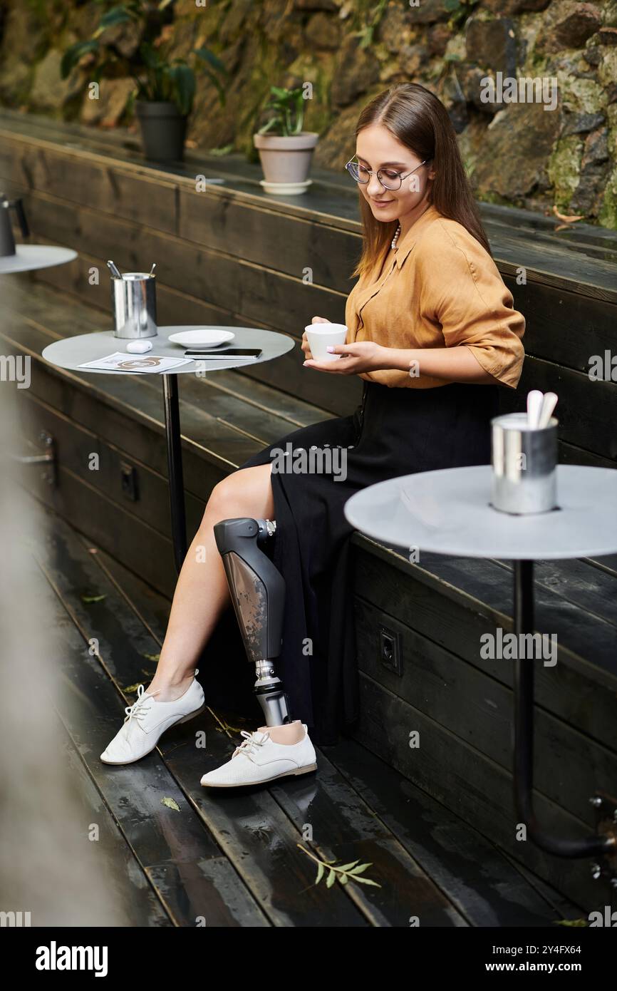 In a cozy cafe setting, a young woman with a prosthetic leg lovingly ...