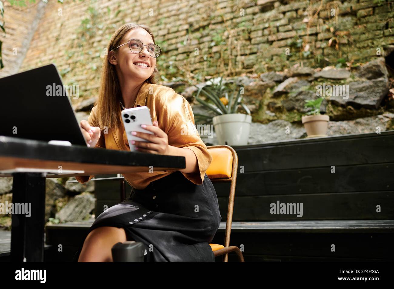 In a lively cafe setting, a young woman with a prosthetic leg engages ...