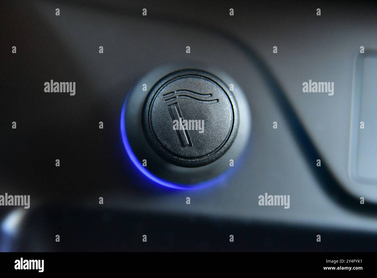 Car cigarette lighter. Cigarette lighter on the dashboard of a ...