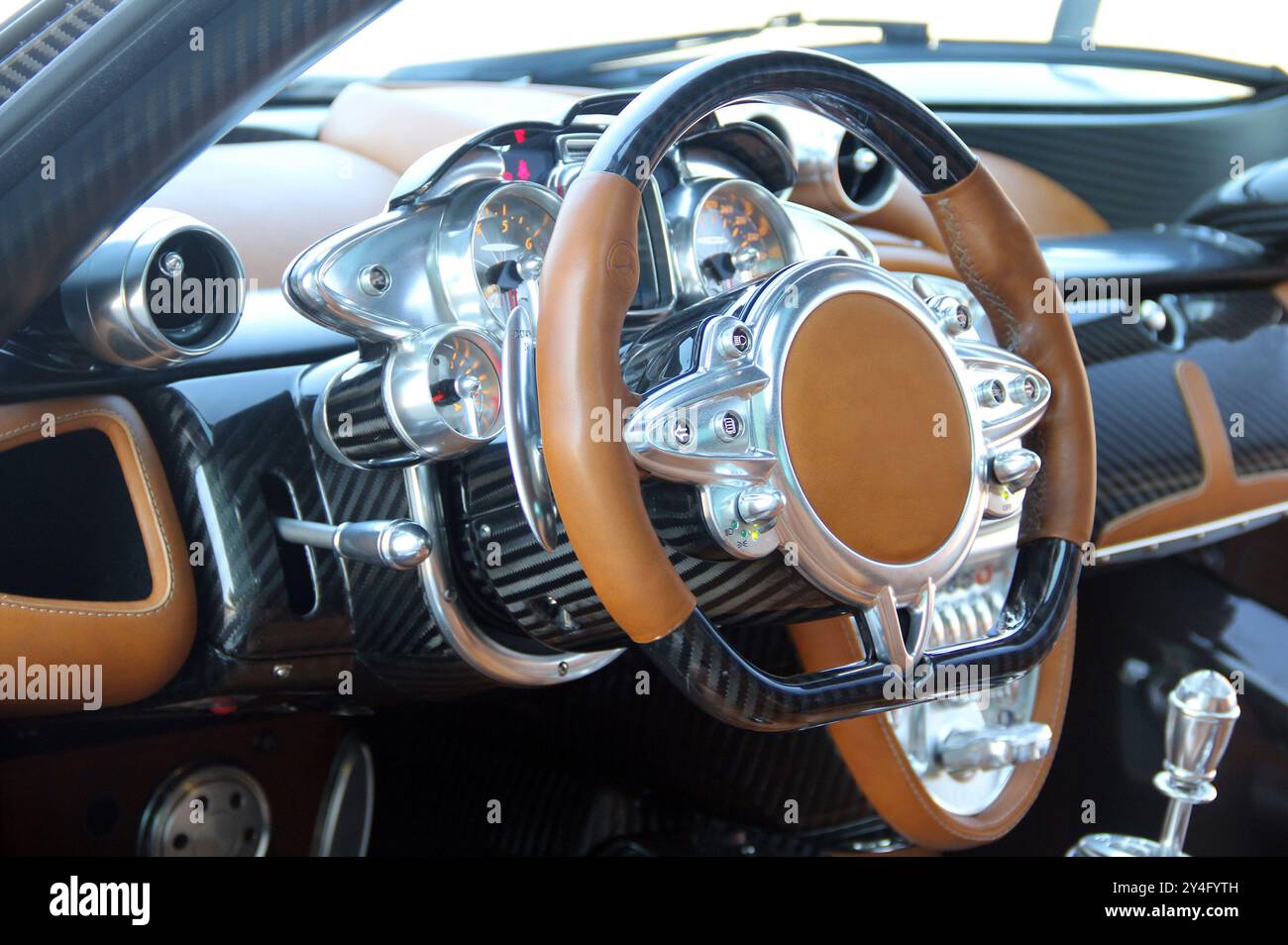 Steering wheel in a modern ultra sports car Stock Photo - Alamy