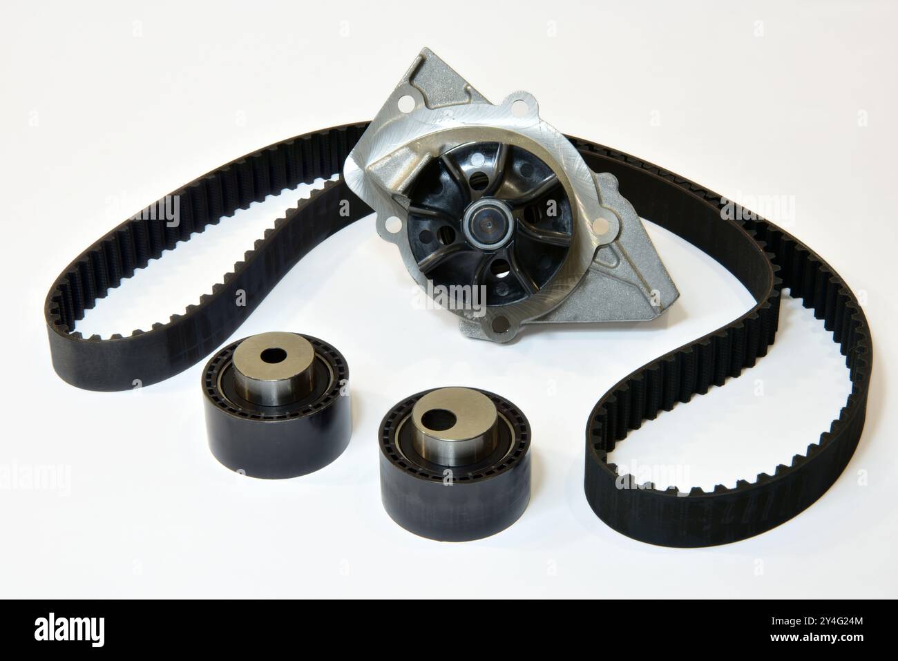 Car engine timing belt, two rollers and water pump. Car engine spare ...