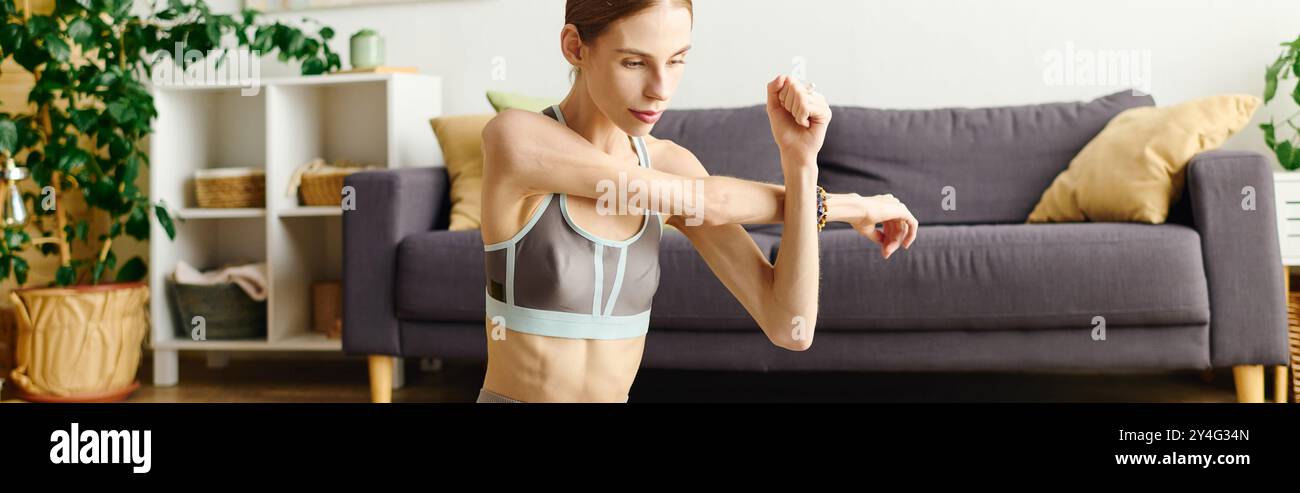The young woman with anorexia engages in a workout routine at home, showcasing her determination ...