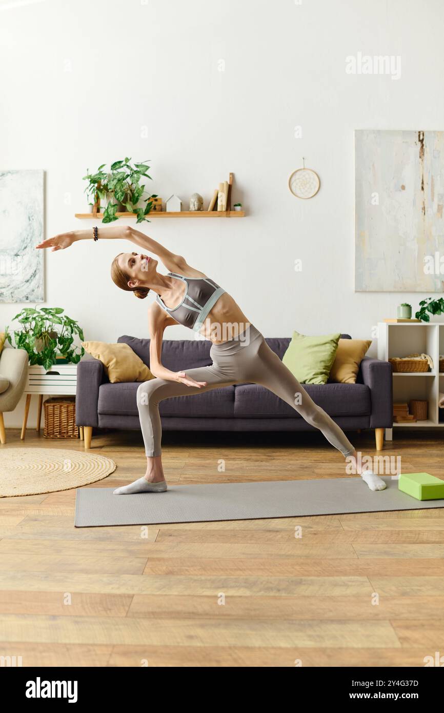 In a cozy living room, a young woman with anorexia embraces her ...