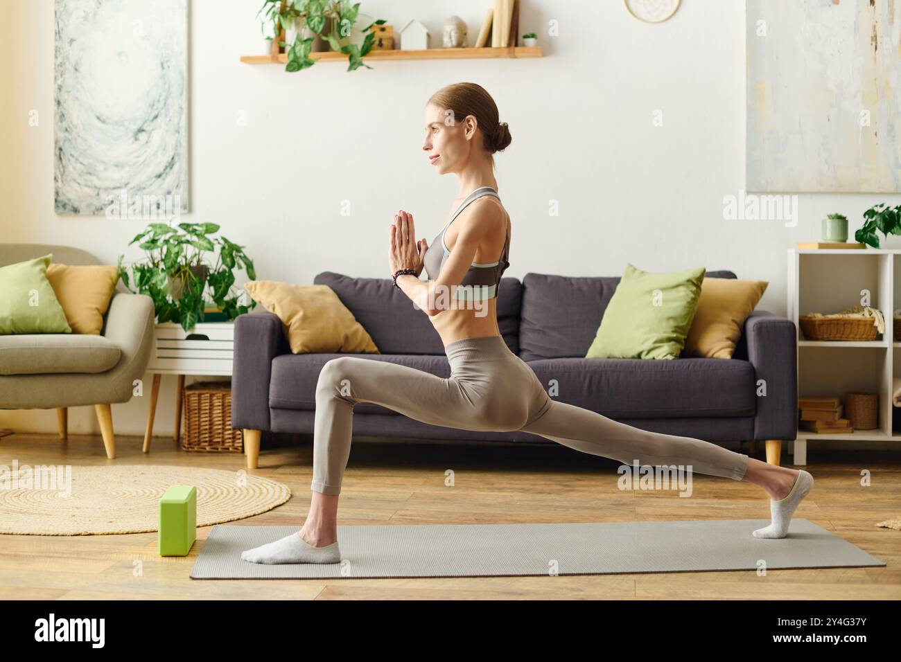 A dedicated young woman with anorexia performs yoga, showcasing her ...