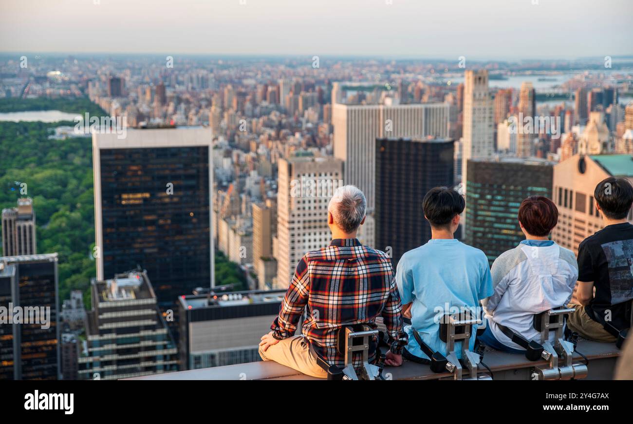 People enjoying the open view of New York City Skyline from open ...