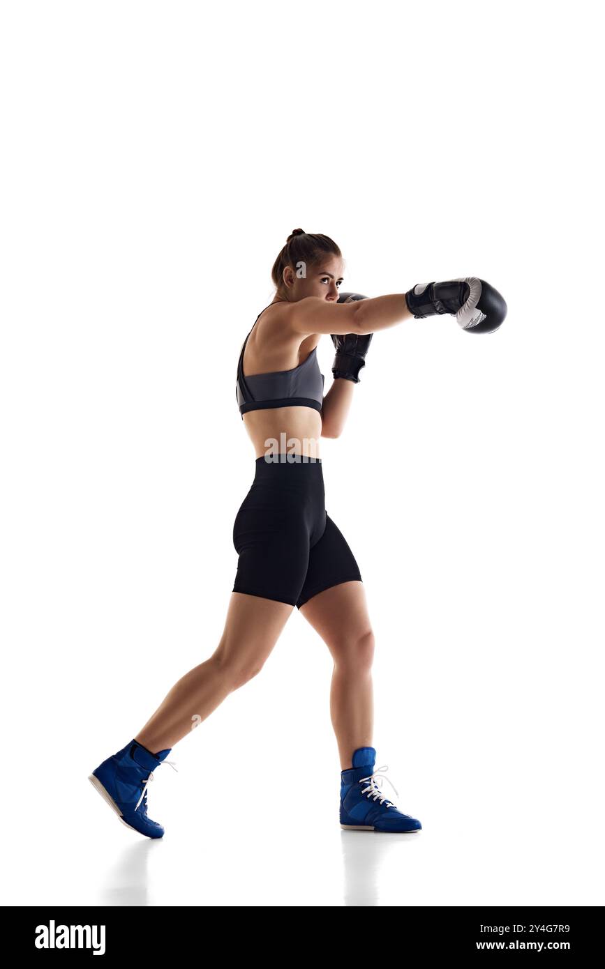 Full-length image of concentrated young girl with athletic body ...