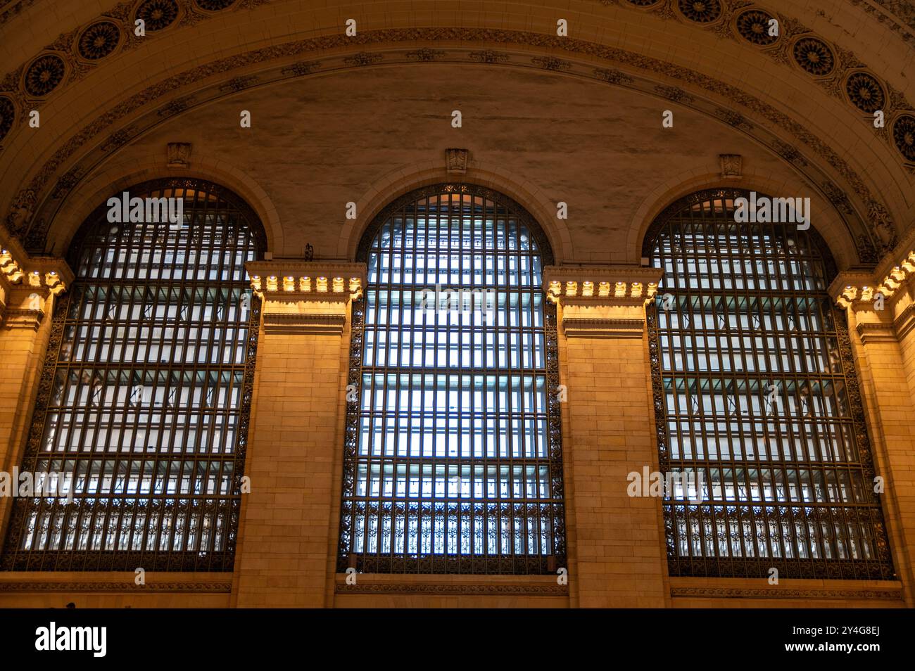Arches style luxury windows with golden lights on wall Stock Photo - Alamy