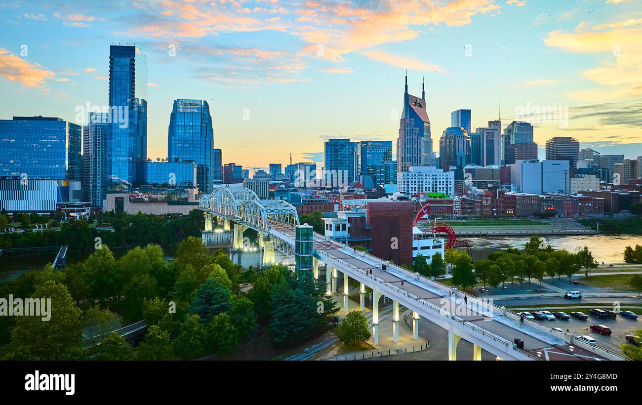 Aerial View of Nashville Skyline with Sunset Over Pedestrian Bridge ...