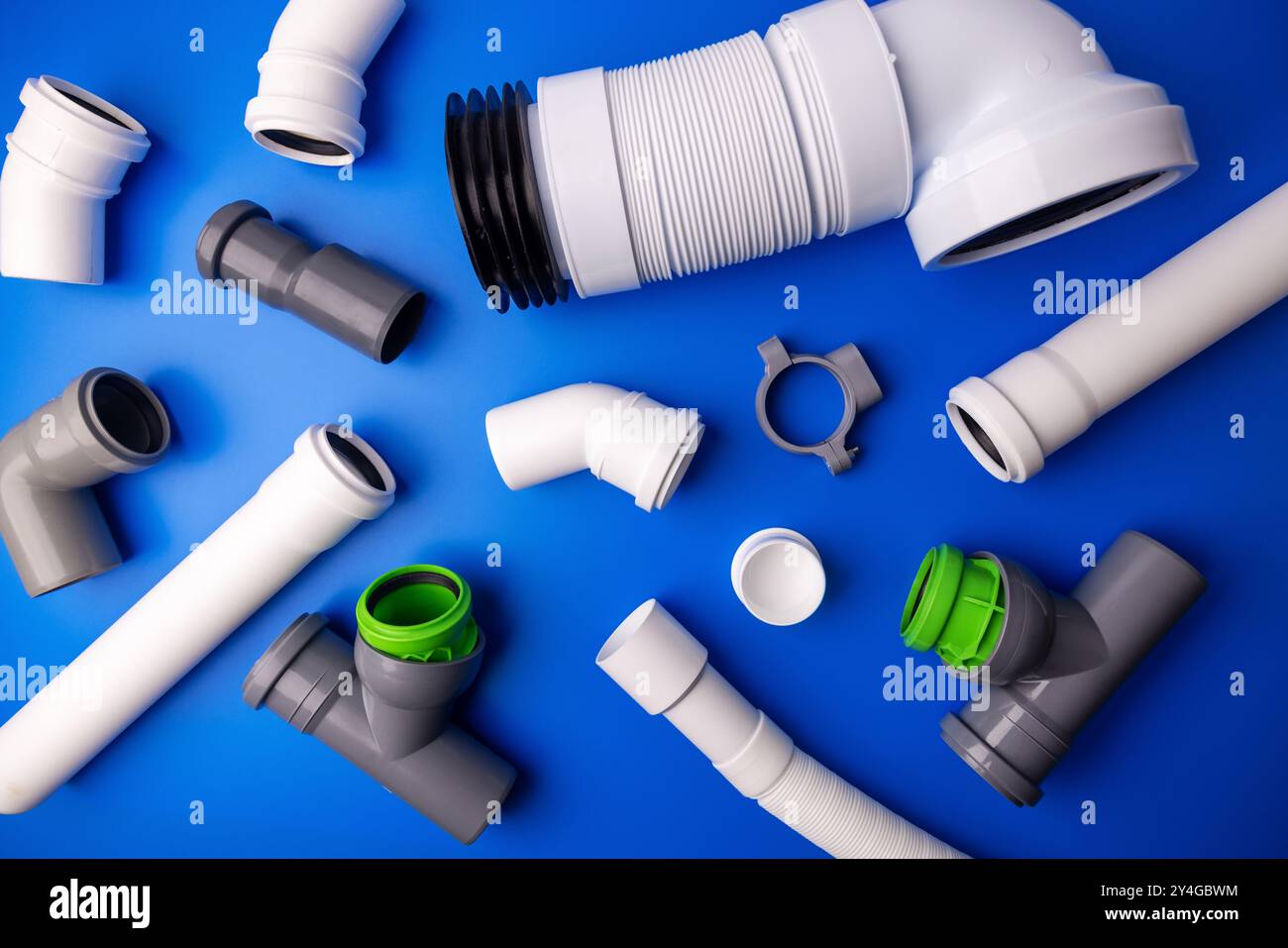 PVC drainage pipes and fittings on blue background. top view Stock ...