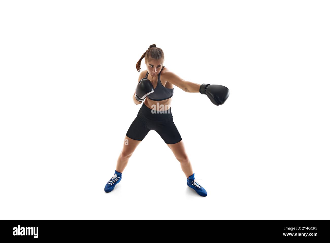Dynamic image of athletic young woman in motion, training, boxing ...