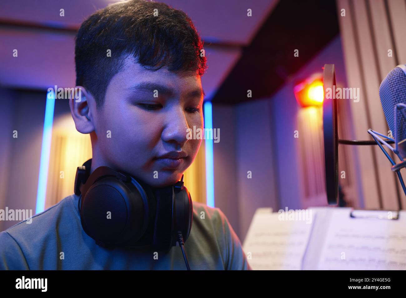 Teenager Using Recording Studio Microphone Preparing Speech Stock Photo ...