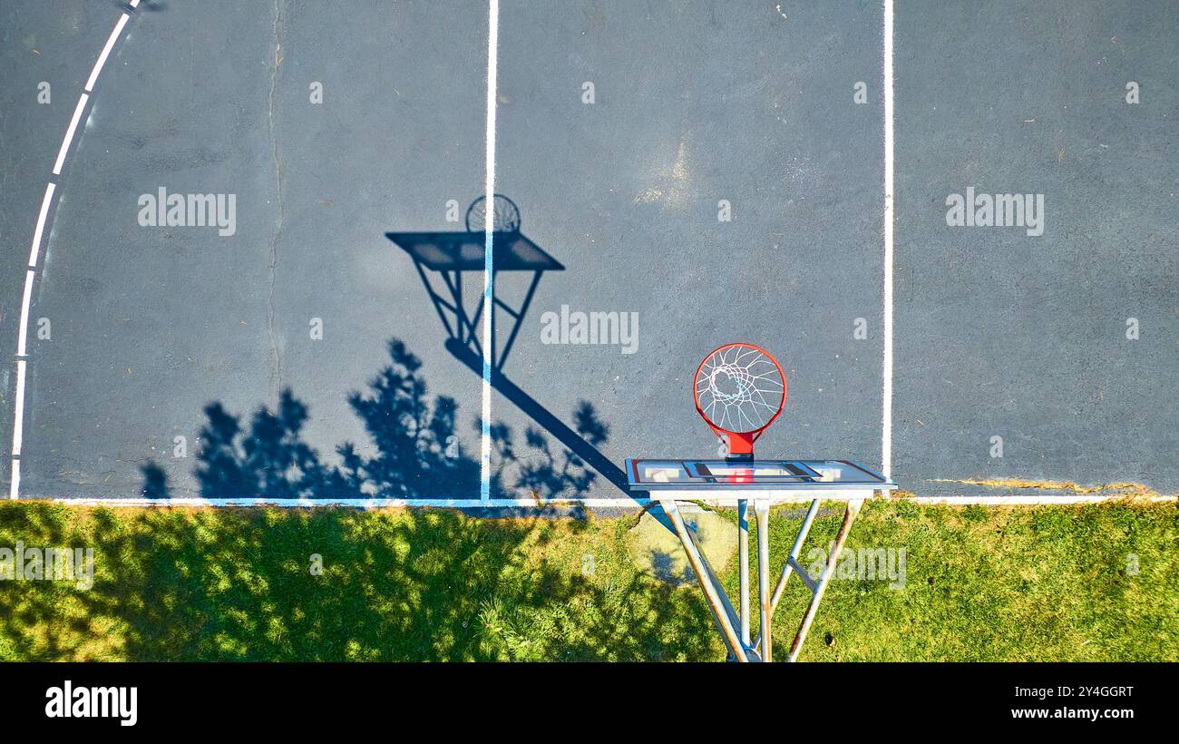 Aerial Top Down Detail of Basketball Court and Hoop Shadow at Golden ...